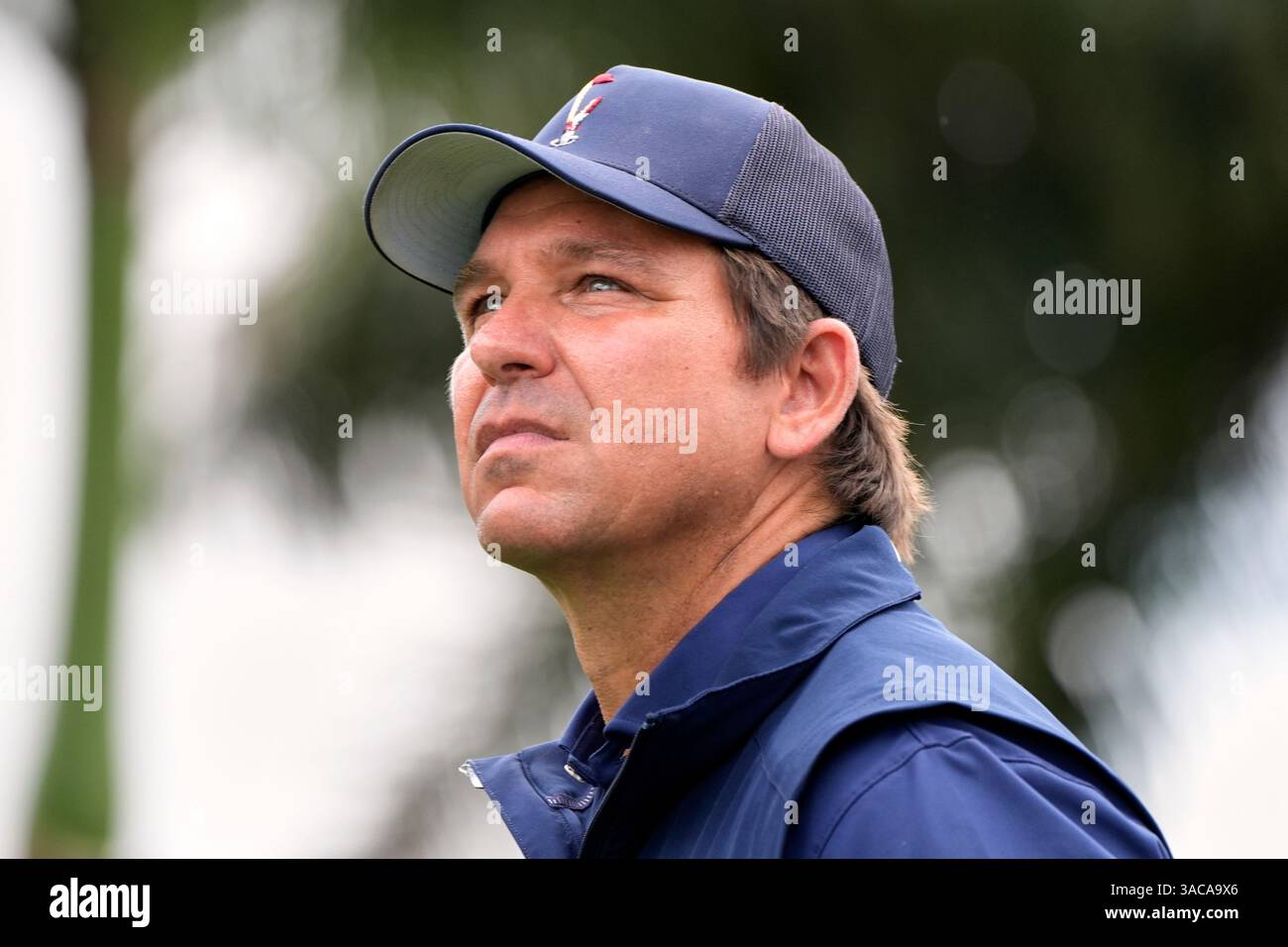 Fla. Gov. Ron DeSantis watches a shot at Trump National Doral during ...