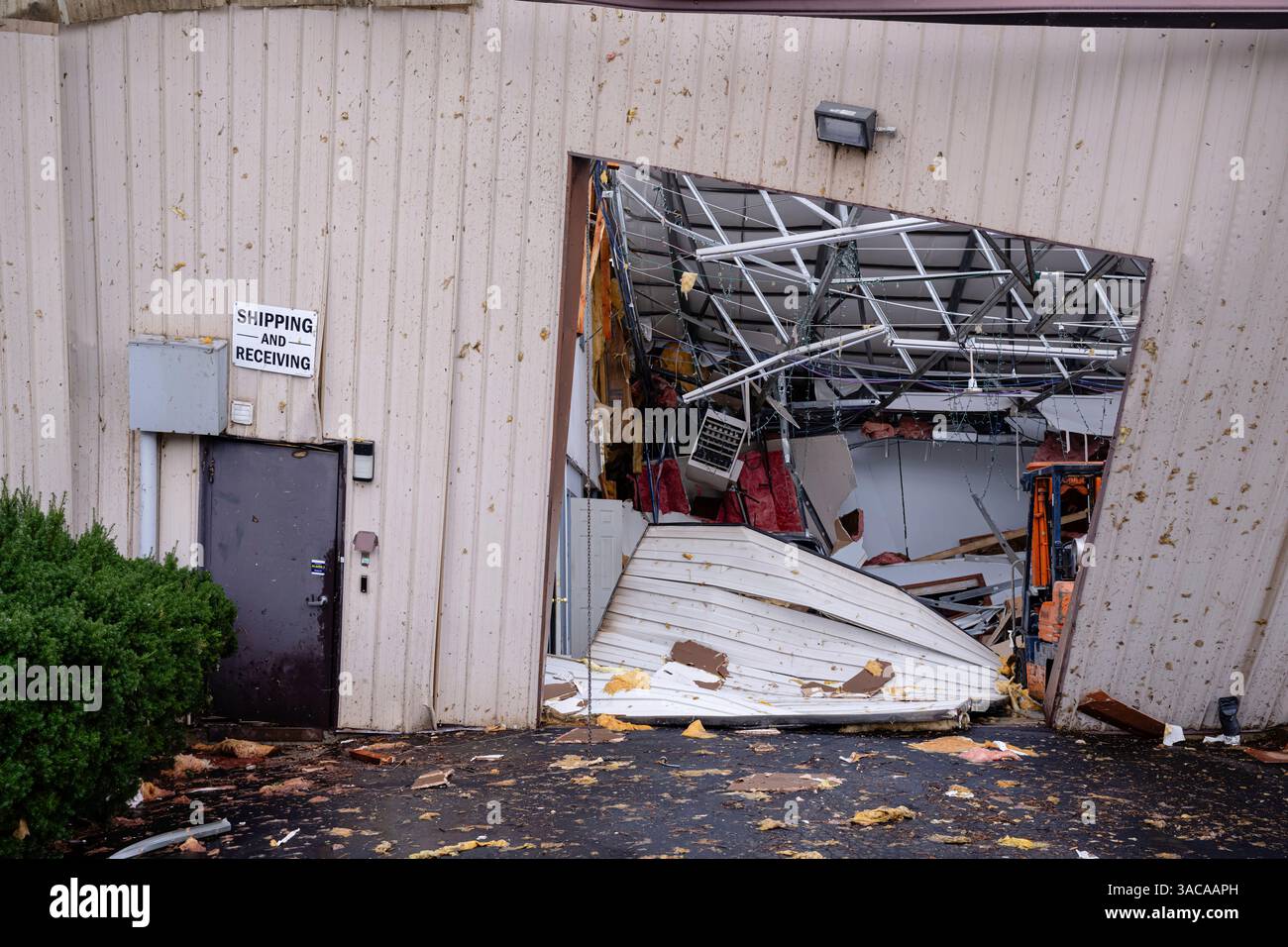 A shipping and receiving bay door is damaged along with the interior of ...