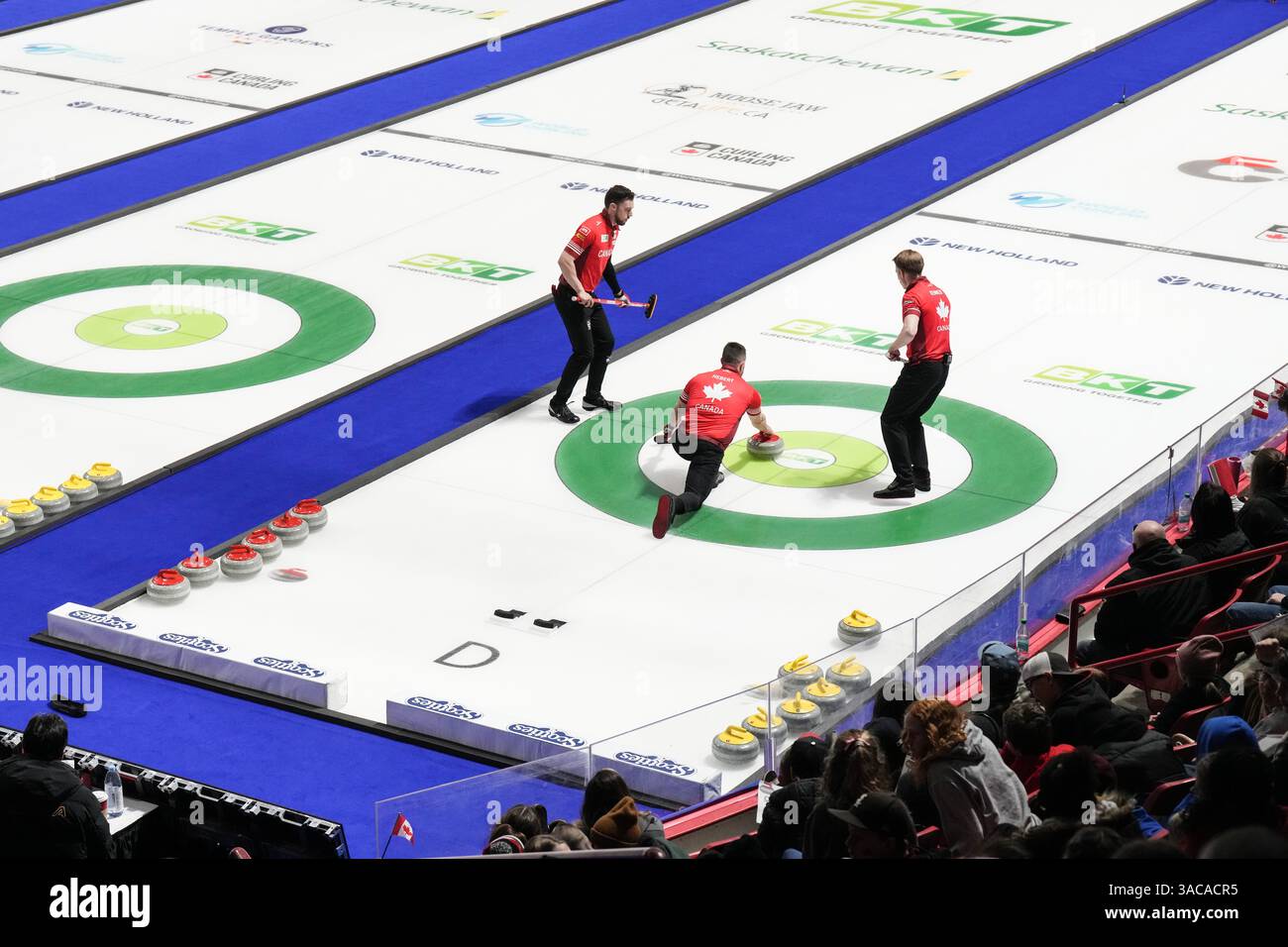 Canada's Ben Hebert throws a stone as Brett Gallant and Marc Kennedy ...