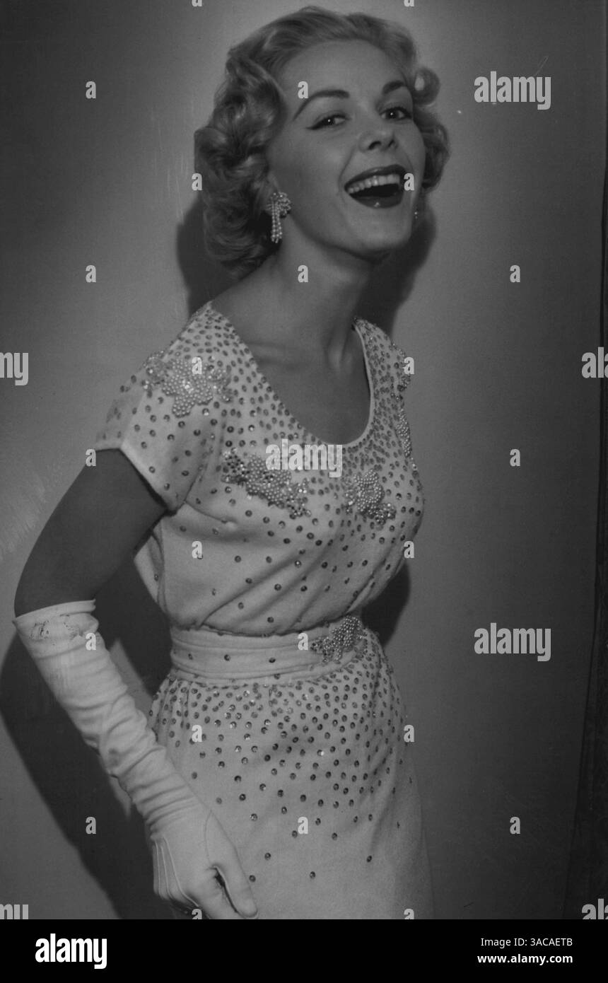 All that glitters is not gold but on this white sheath frock of knitted ...