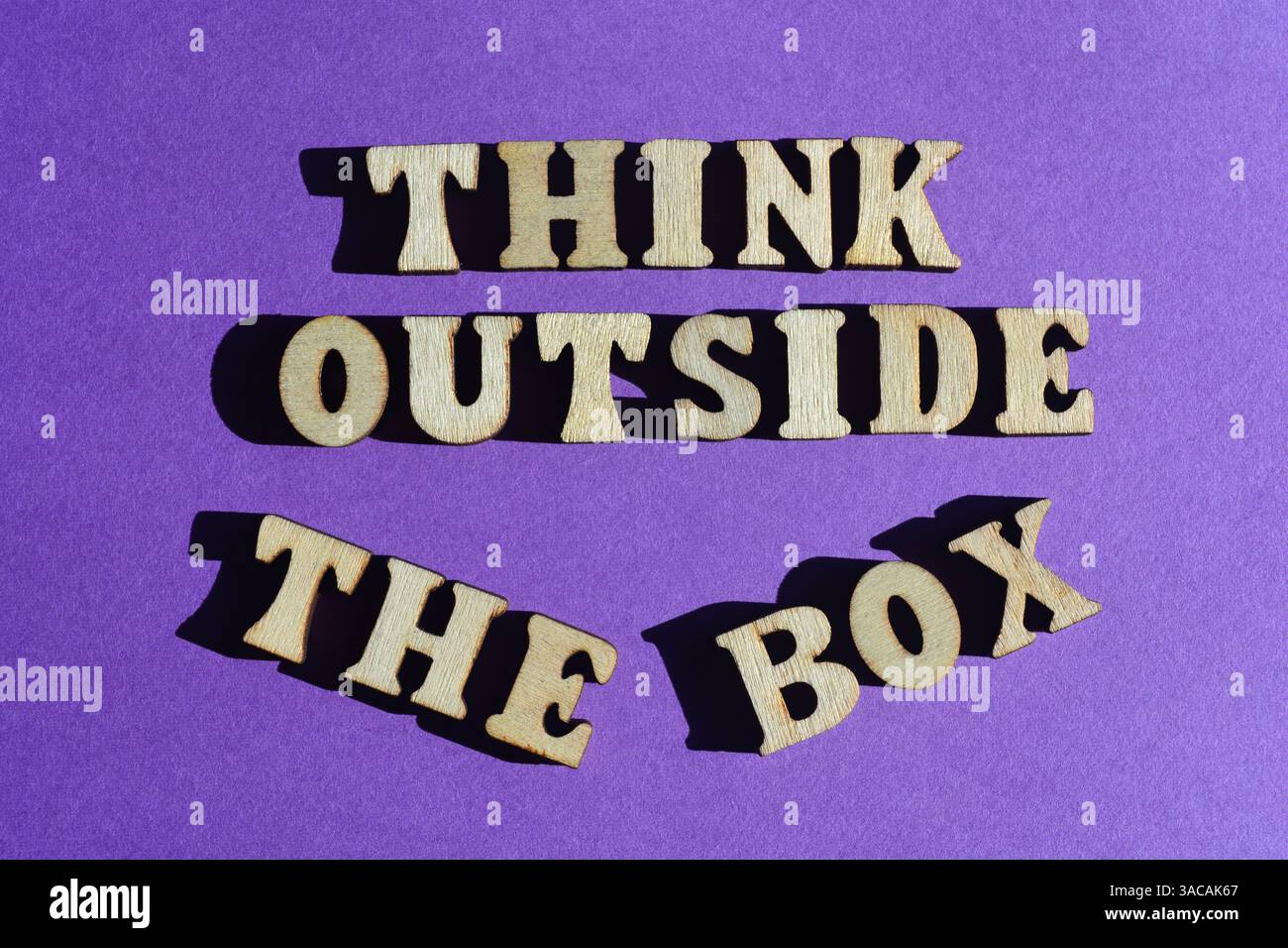 Think Outside The Box, words in wooden alphabet letters isolated on ...