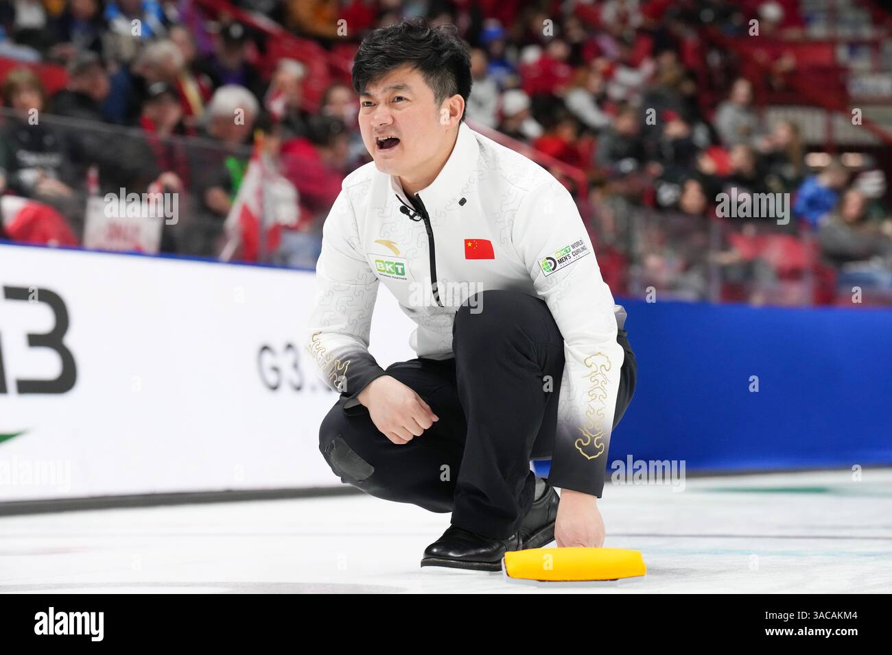 China skip Xiaoming Xu watches his stone stone during his country's 2-8 loss to Canada at the ...