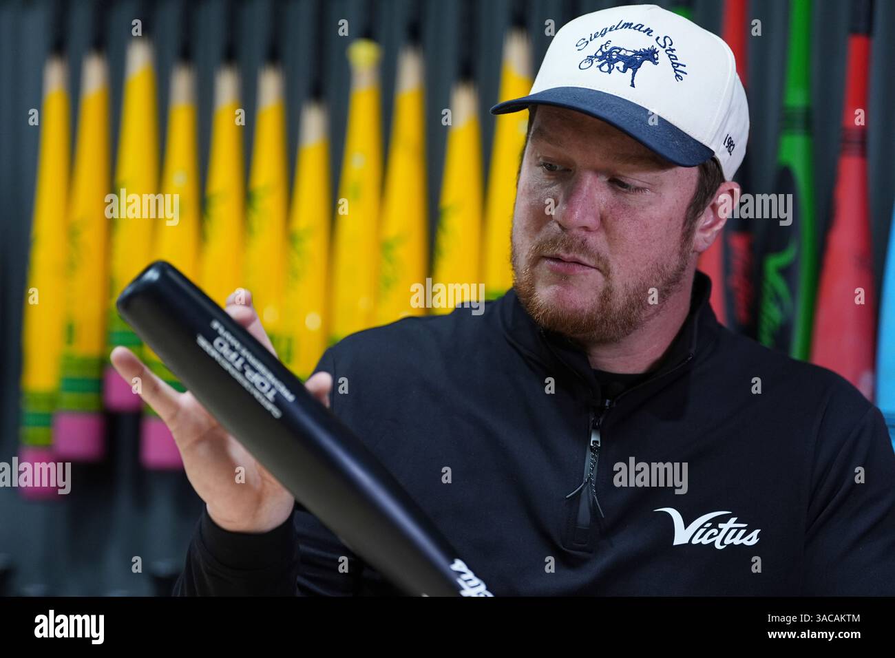 Jared Smith speaks about torpedo baseball bats during an interview at ...