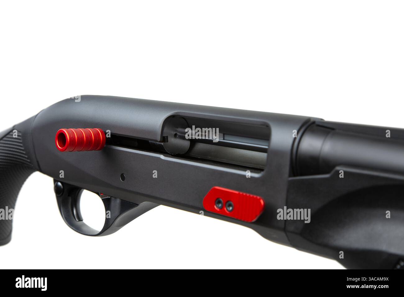 Close-up view of a tactical shotgun featuring a sleek design with red ...