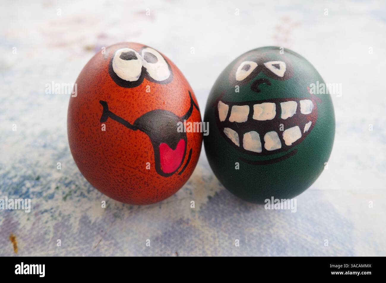 Easter eggs dyed green and brown with painted laughing faces. Funny ...