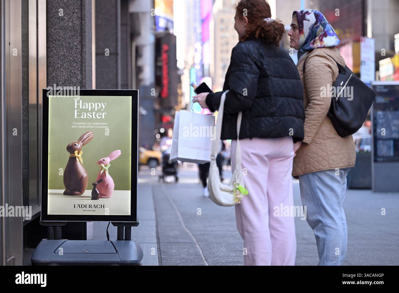 New York, USA. 02nd Apr, 2025. A sign celebrating Easter seen as two ...