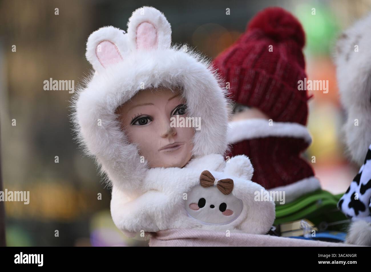 A mannequin is adorned with a fur hat with rabbit ears in Times Square ...