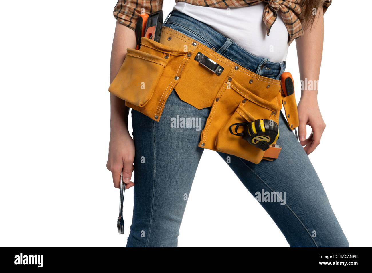 A detailed close-up of a tool belt worn by a worker, featuring a wrench ...