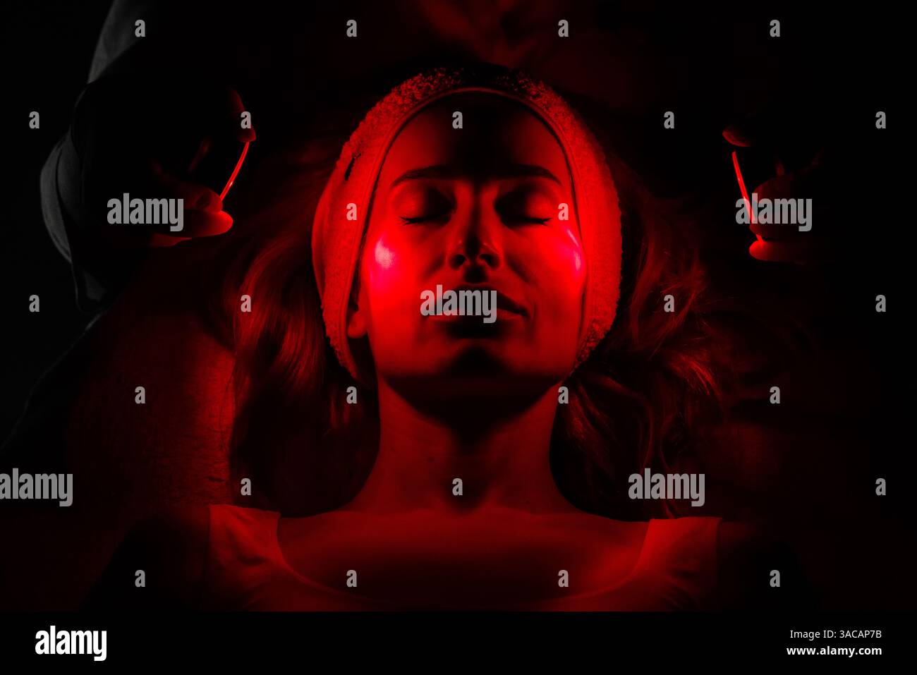 A woman undergoes LED light therapy, a non-invasive facial treatment to ...