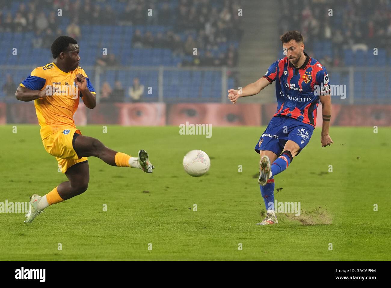 Basel, Switzerland. 03rd Apr, 2025. Nestory Irankunda (Grasshopper Club Zurich, #66) and Dominik ...