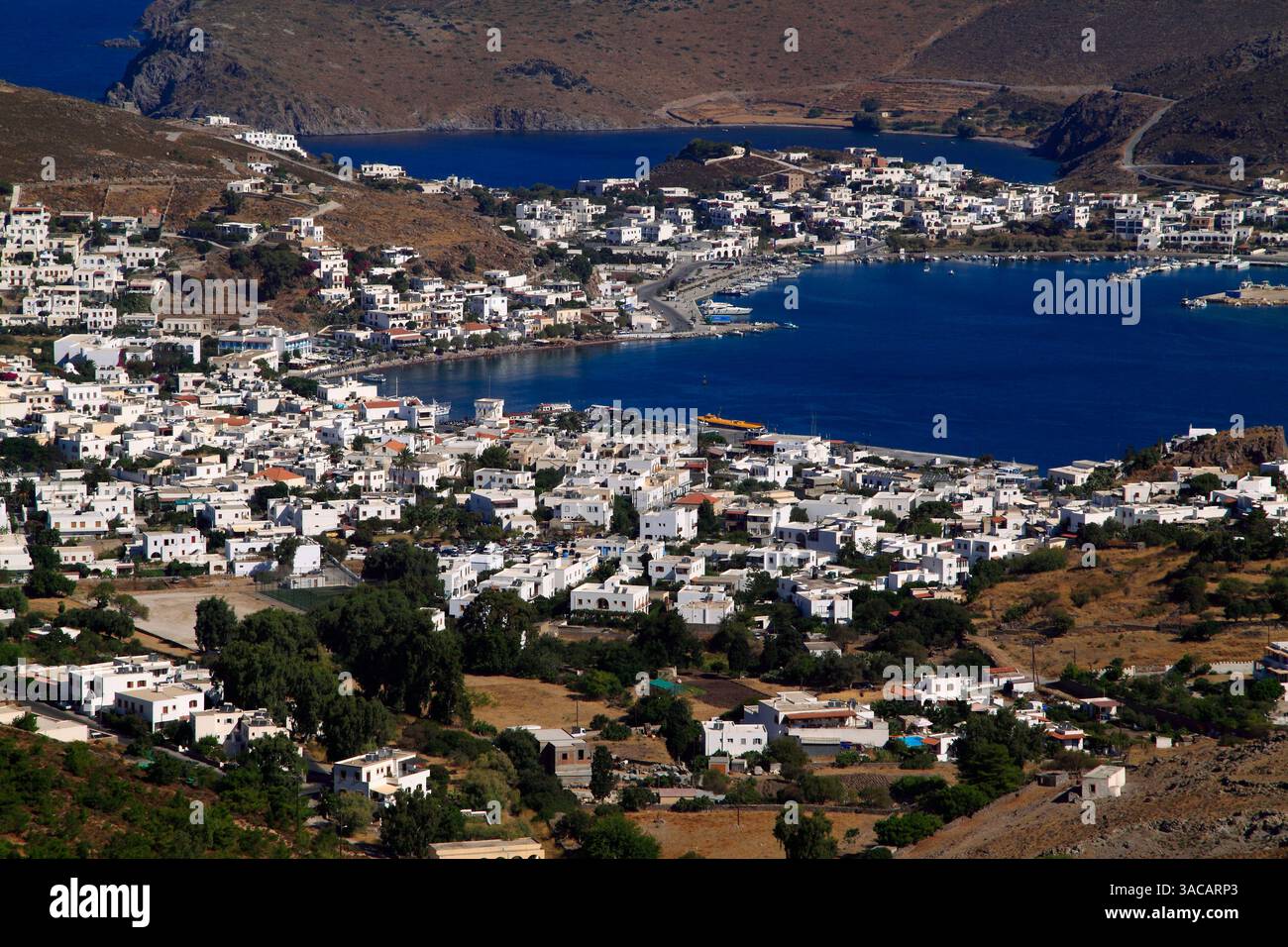 Greece, Dodecanese Islands, Patmos. Skala and bay viewed from Monastery ...