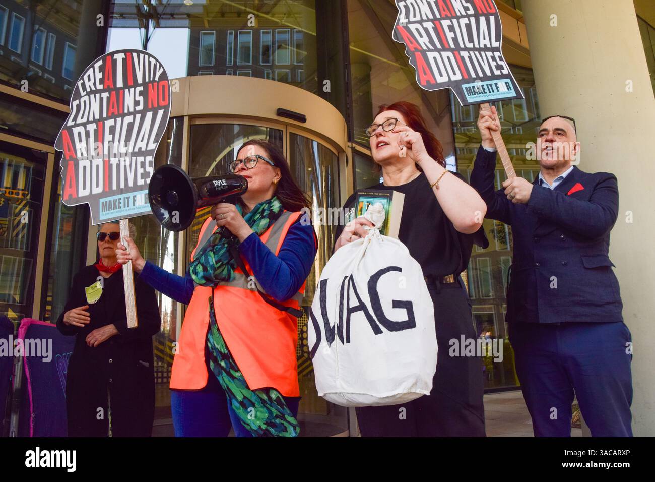 London, UK. 03rd Apr, 2025. A protester chants slogans through a ...