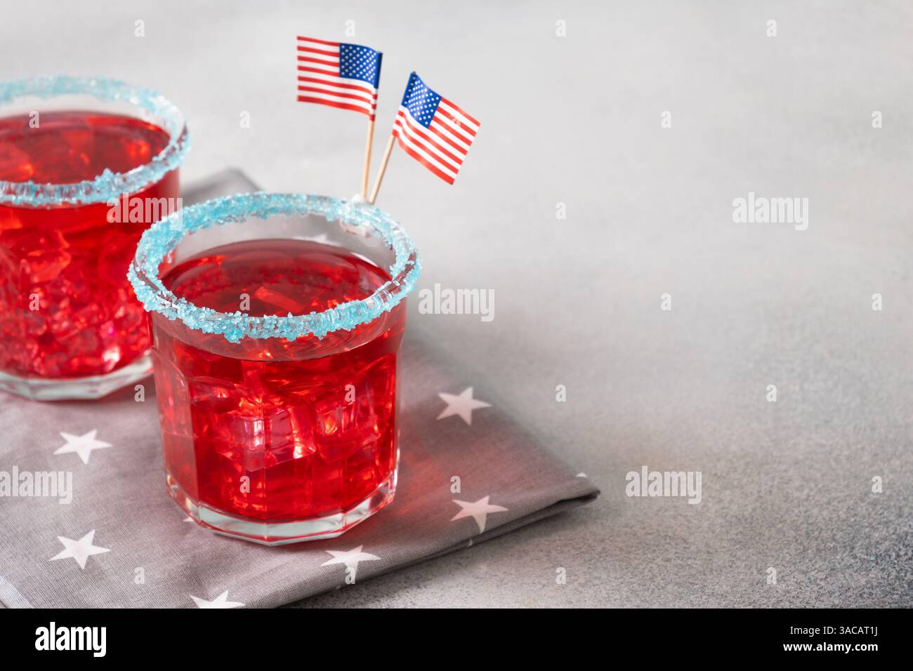 Patriotic red pomegranate Margarita cocktails on gray background ...