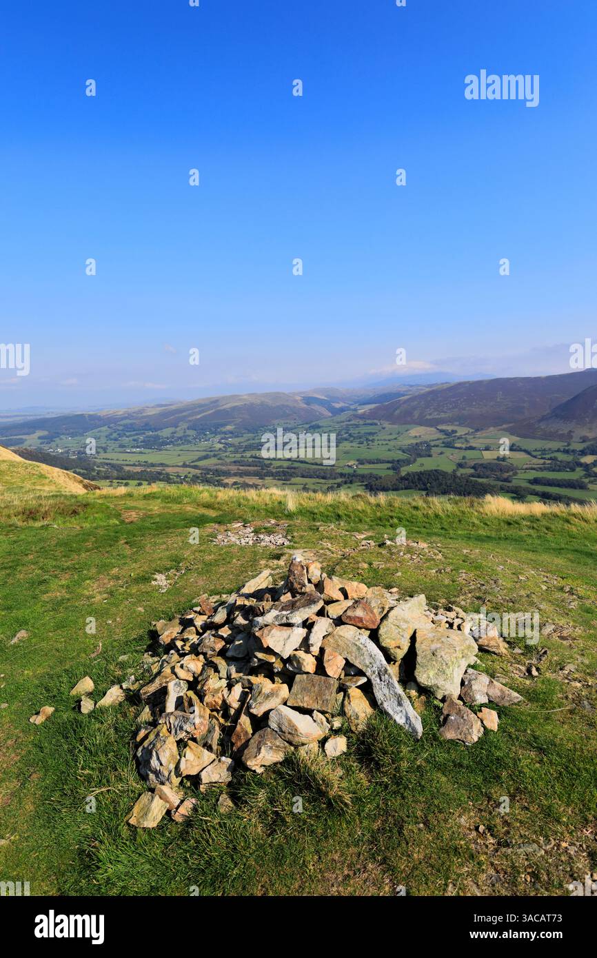 View of the summit cairn of Low fell, above the Vale of Lorton, Lake ...