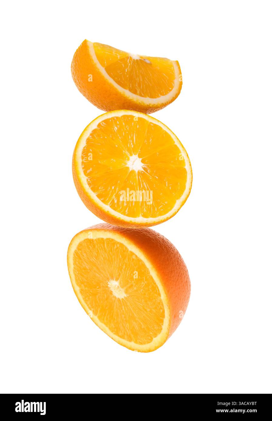 Fresh cut oranges falling on white background Stock Photo - Alamy