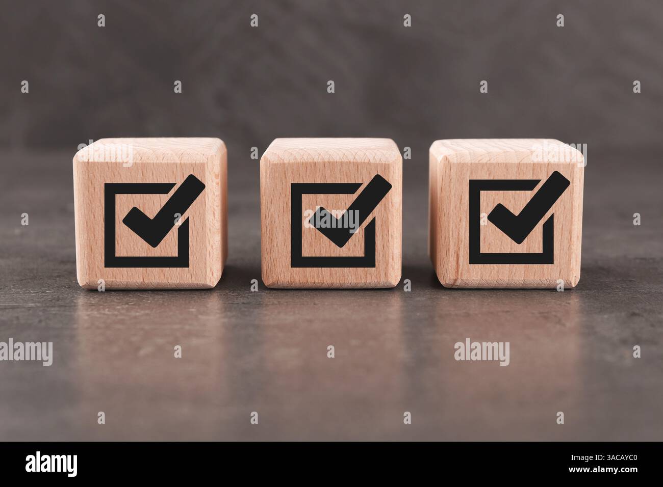 Approved. Wooden cubes with check marks on grey table, closeup Stock ...
