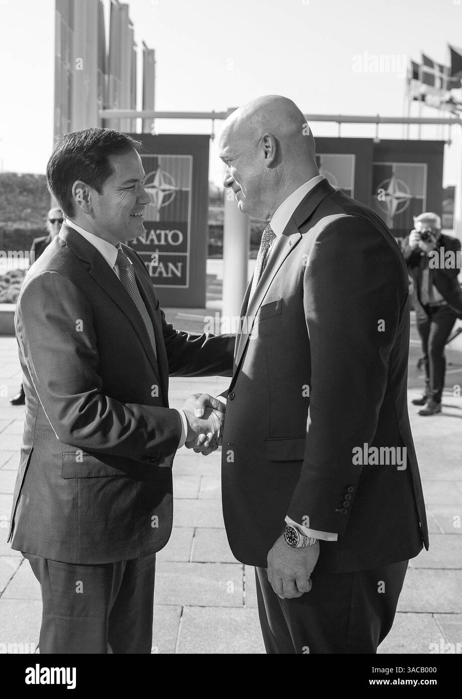 Secretary Marco Rubio is greeted by U.S. Ambassador to NATO Matthew ...