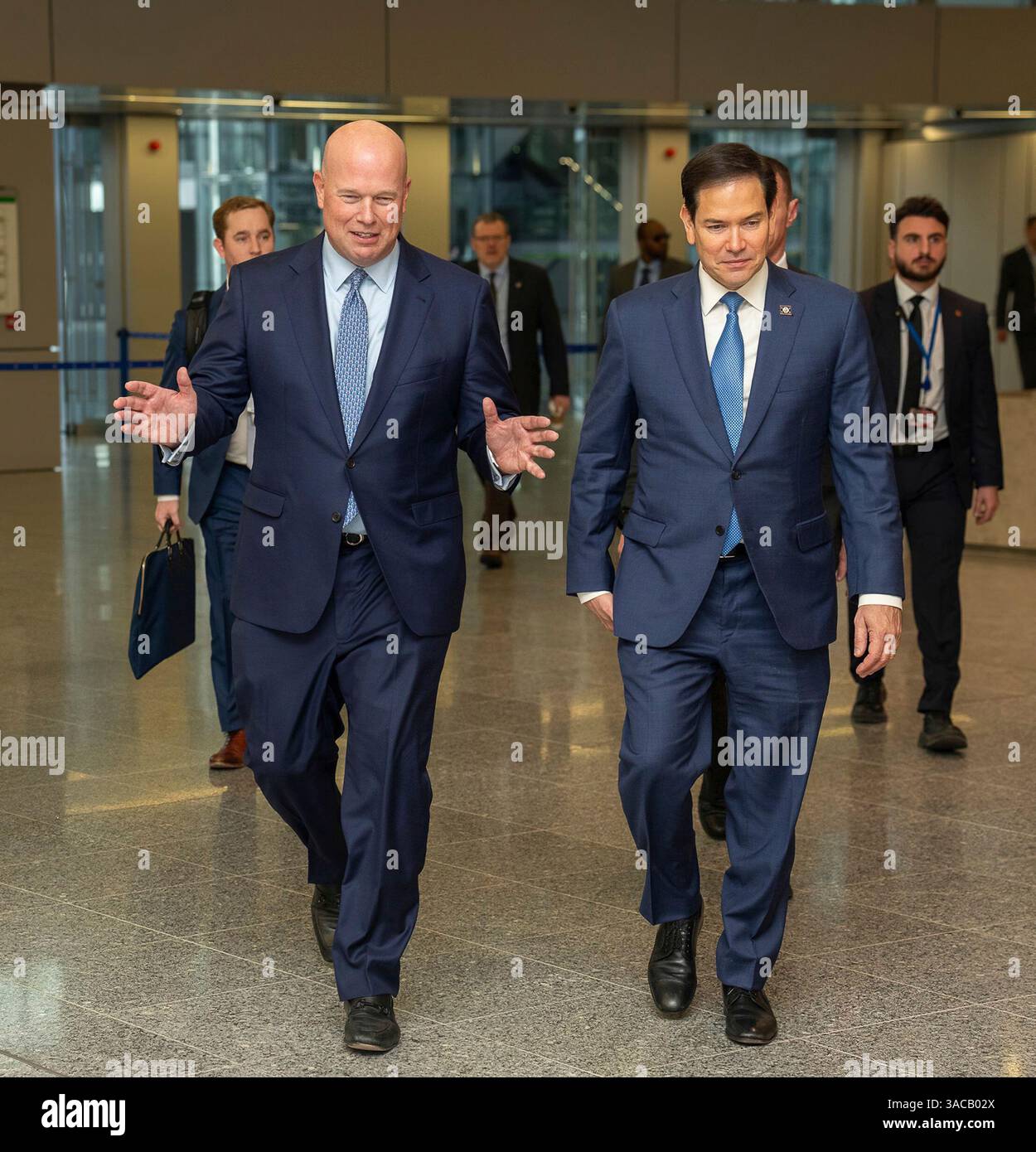Secretary Marco Rubio is greeted by U.S. Ambassador to NATO Matthew ...