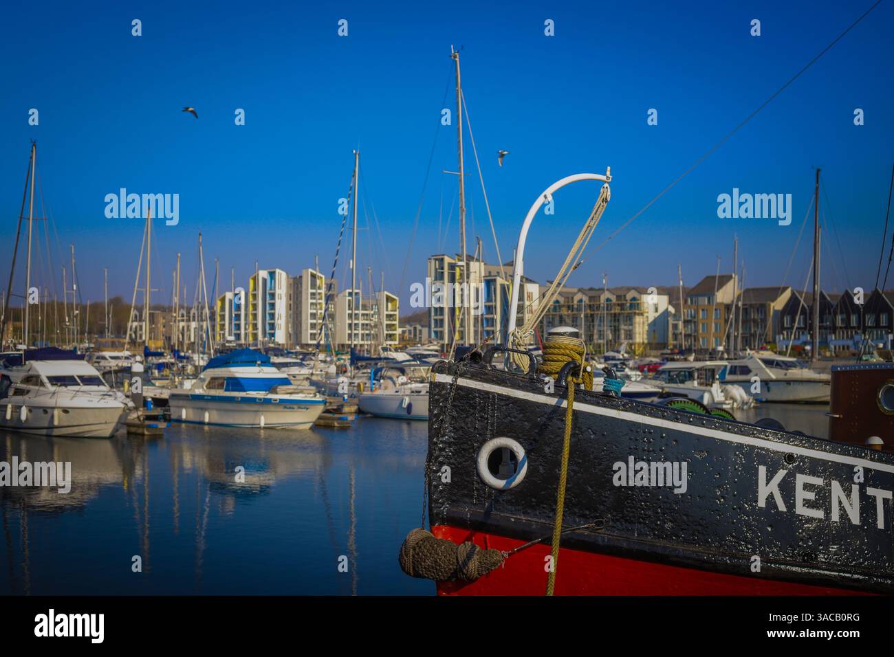 Modern waterside properties and apartments surrounding marina at ...