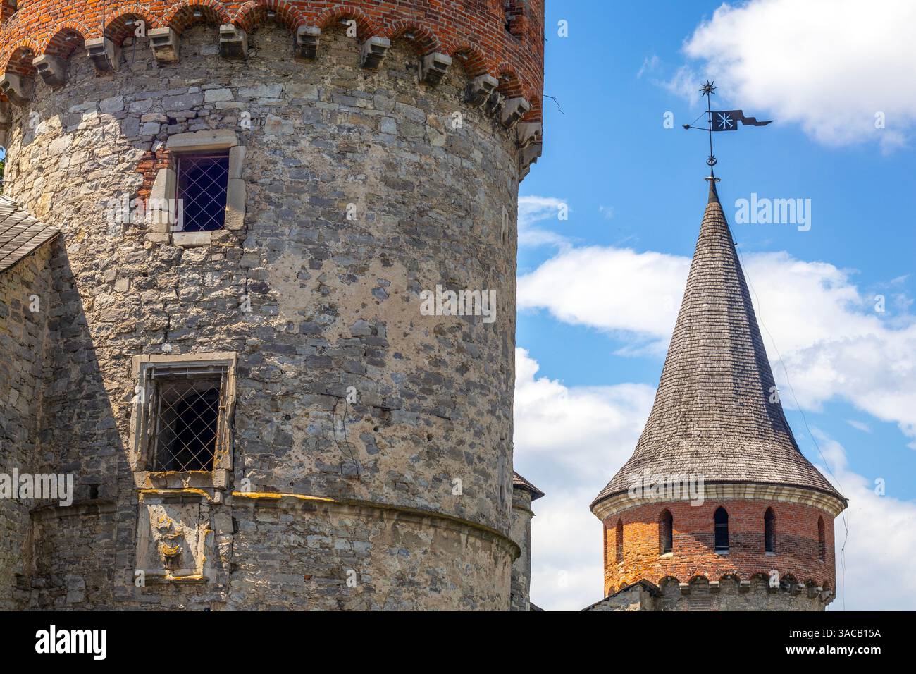 Kamianets-Podilskyi, June 1, 2024. Historic stone castle towers under a ...