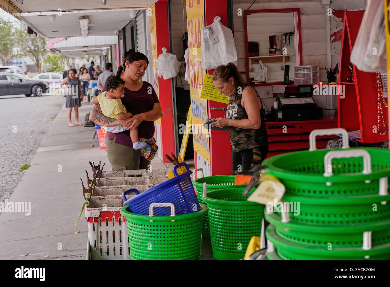 Moe Termine, right, takes a customer's order at Amy's Seafood, a vendor ...