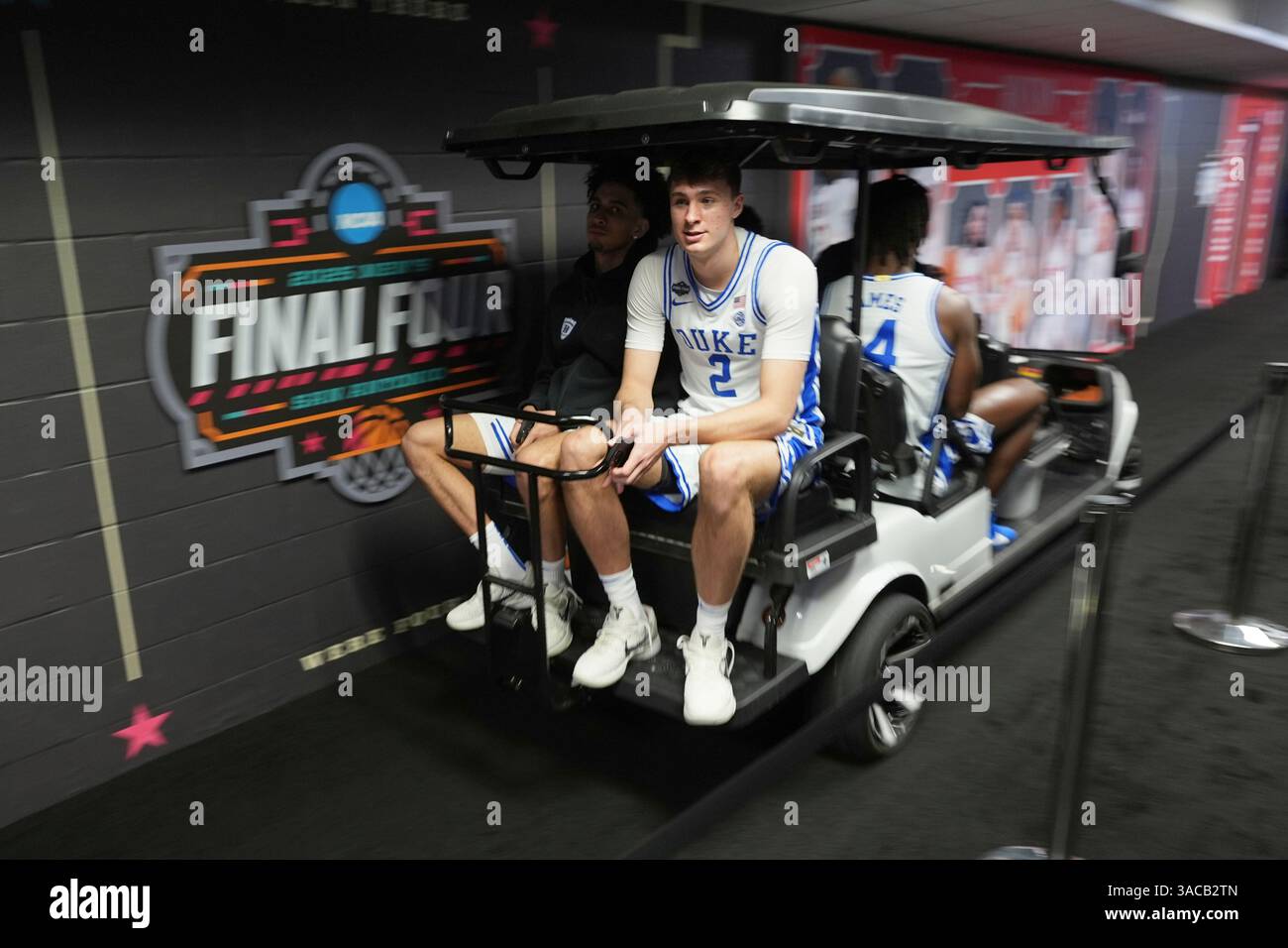 Duke's Cooper Flagg (2) and Tyrese Proctor sit on the back of a cart during media day at the ...