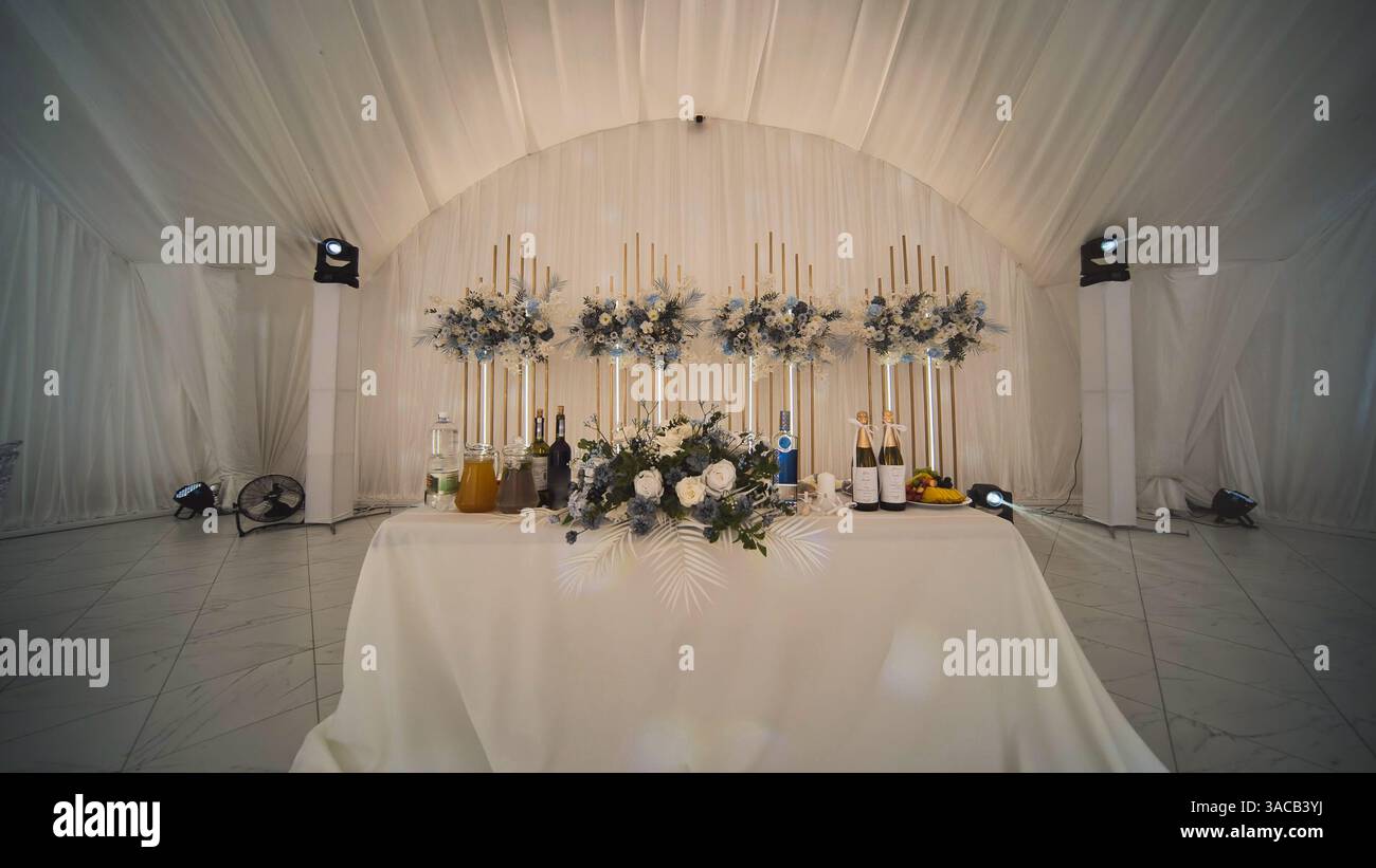 Elegant wedding reception table setup featuring floral decorations ...