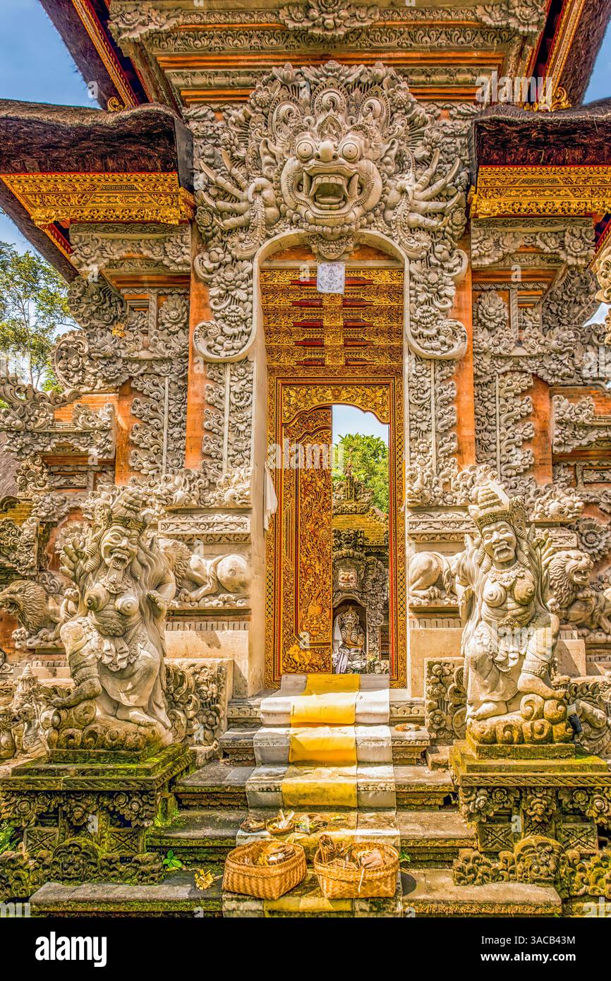 Bali, Indonesia. Portrait of carved gates considered to connect the ...