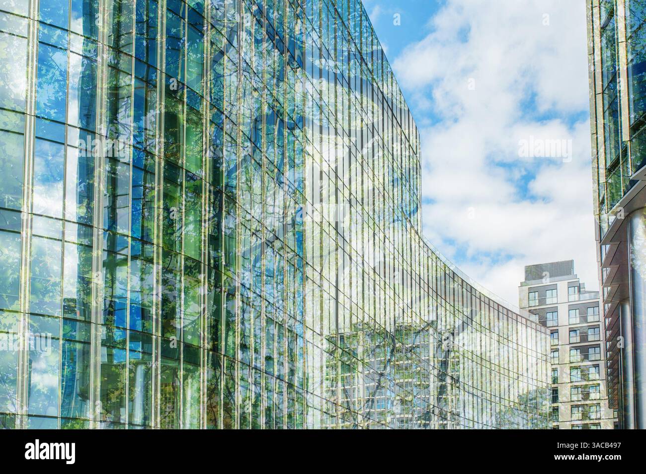 Modern buildings and lush trees against blue sky, double exposure Stock ...