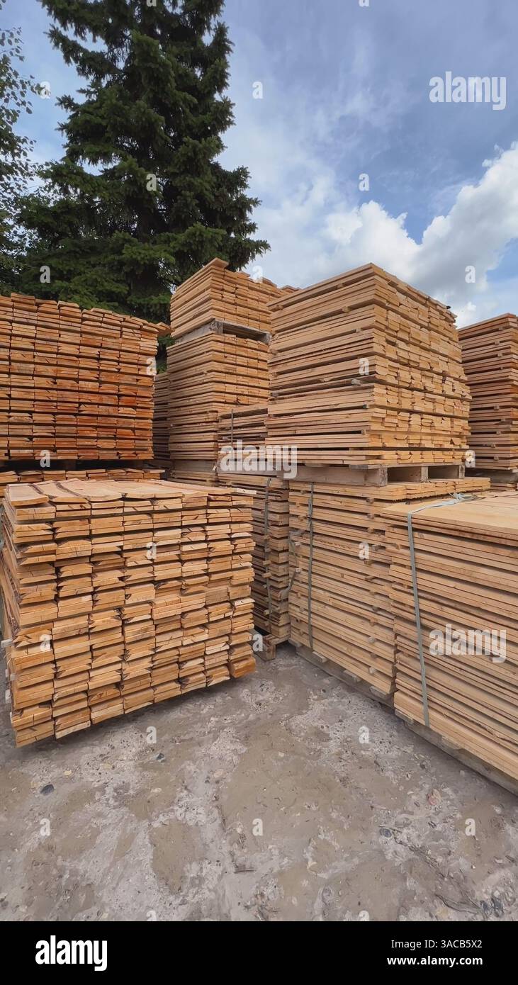 Stacks of wooden planks forming a geometric pattern in a timber ...