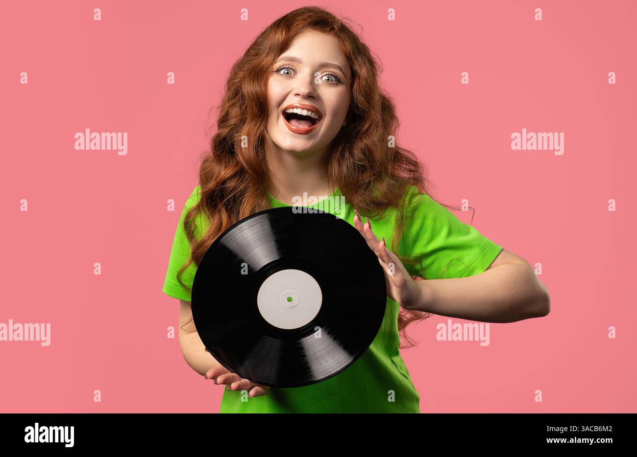 Pretty woman dancing with vinyl record disc on pink. Hobby, music ...