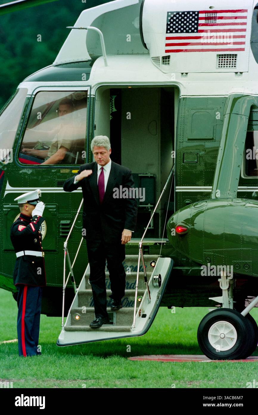 U.S. President Bill Clinton salutes the Marine Guard as he steps off ...