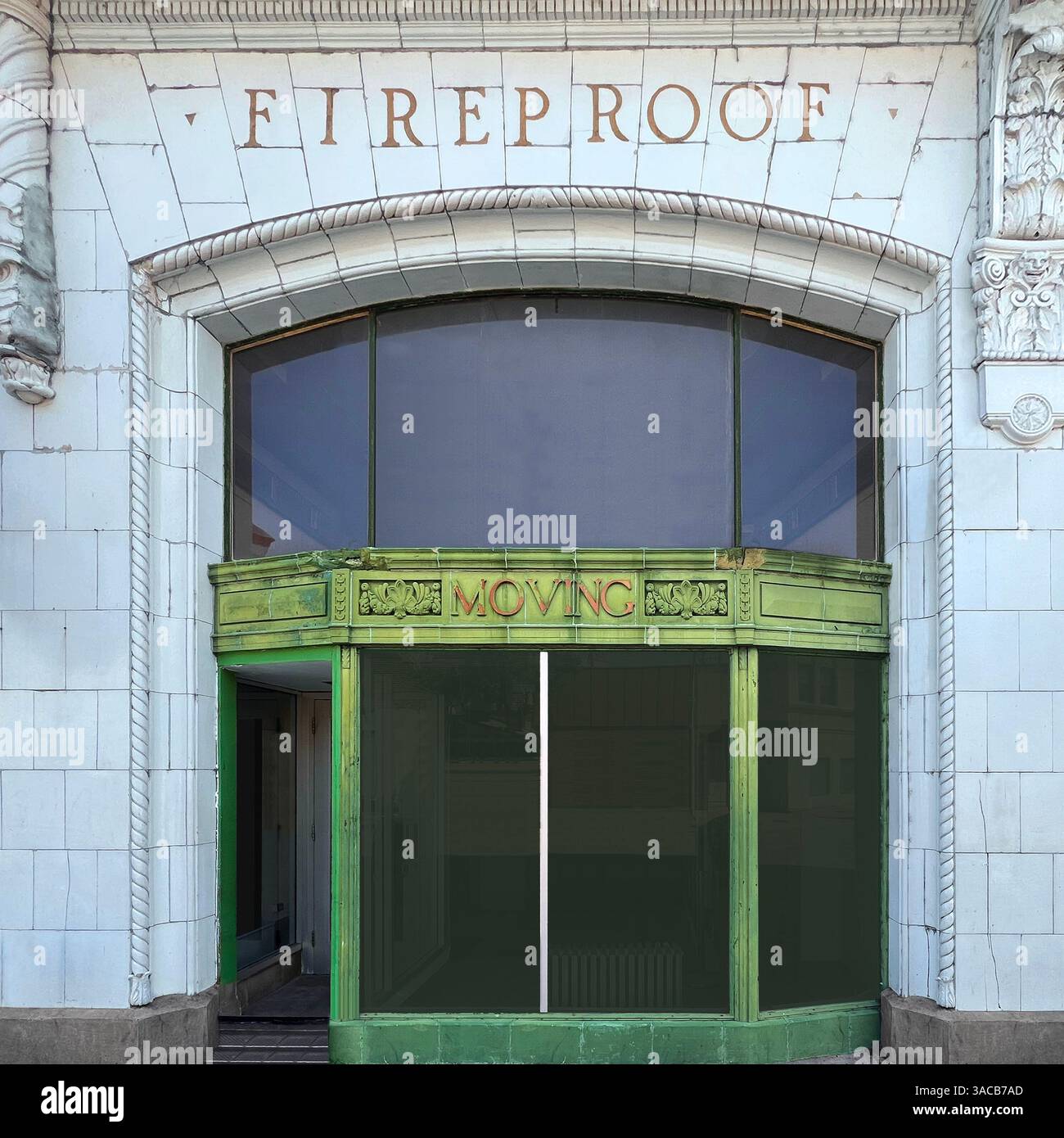 A historic green terra cotta Storage storefront grand arch ...