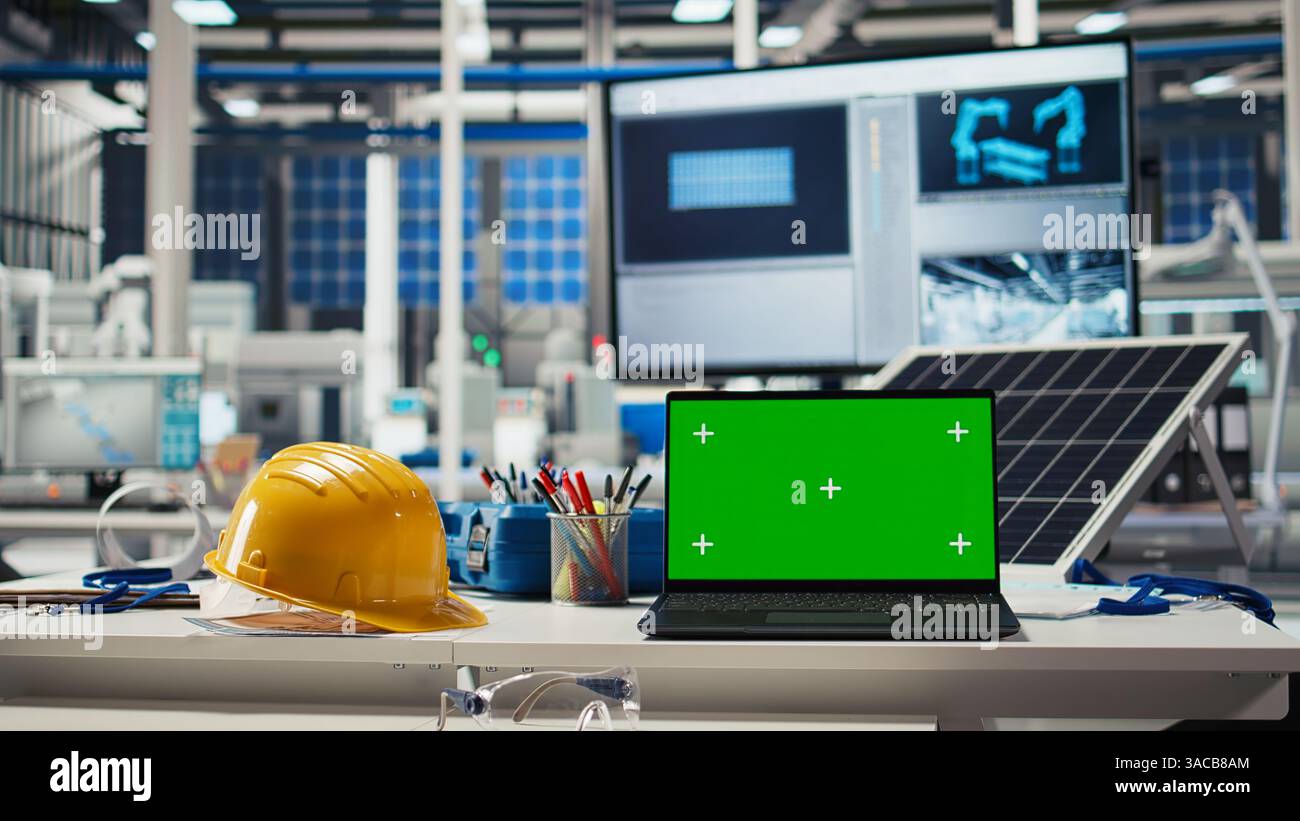 Green screen laptop in photovoltaics facility used for analyzing data ...