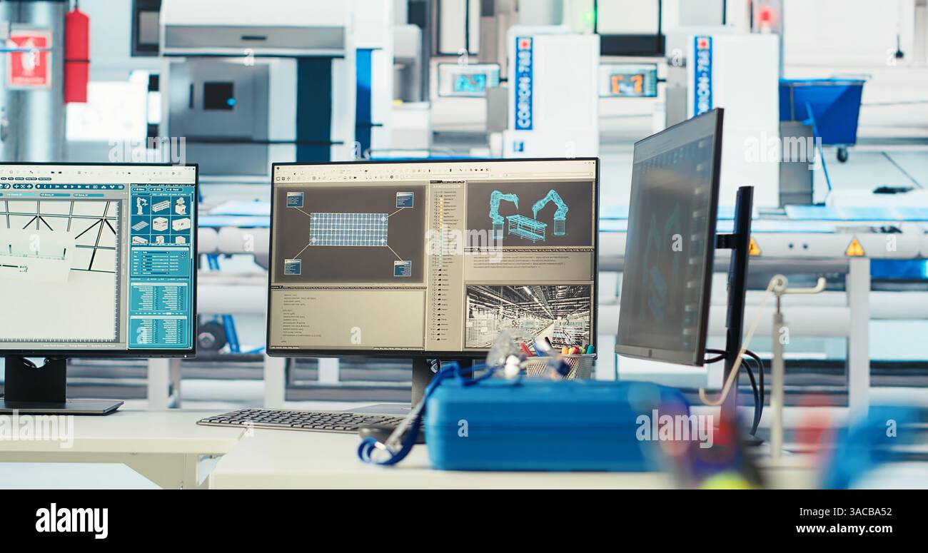 CAD program on PC screen in photovoltaics factory used for designing production lines for solar ...