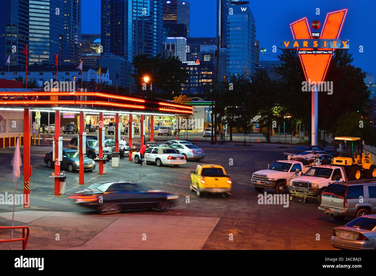 Cars maneuver through the parking lot of the Varsity, a legendary hot ...