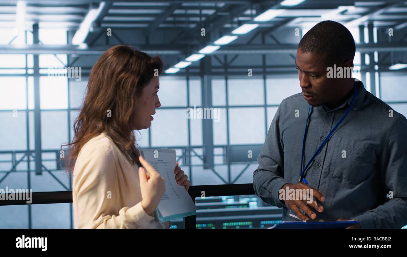 Team of IT professionals looking over data center checkup checklist ...