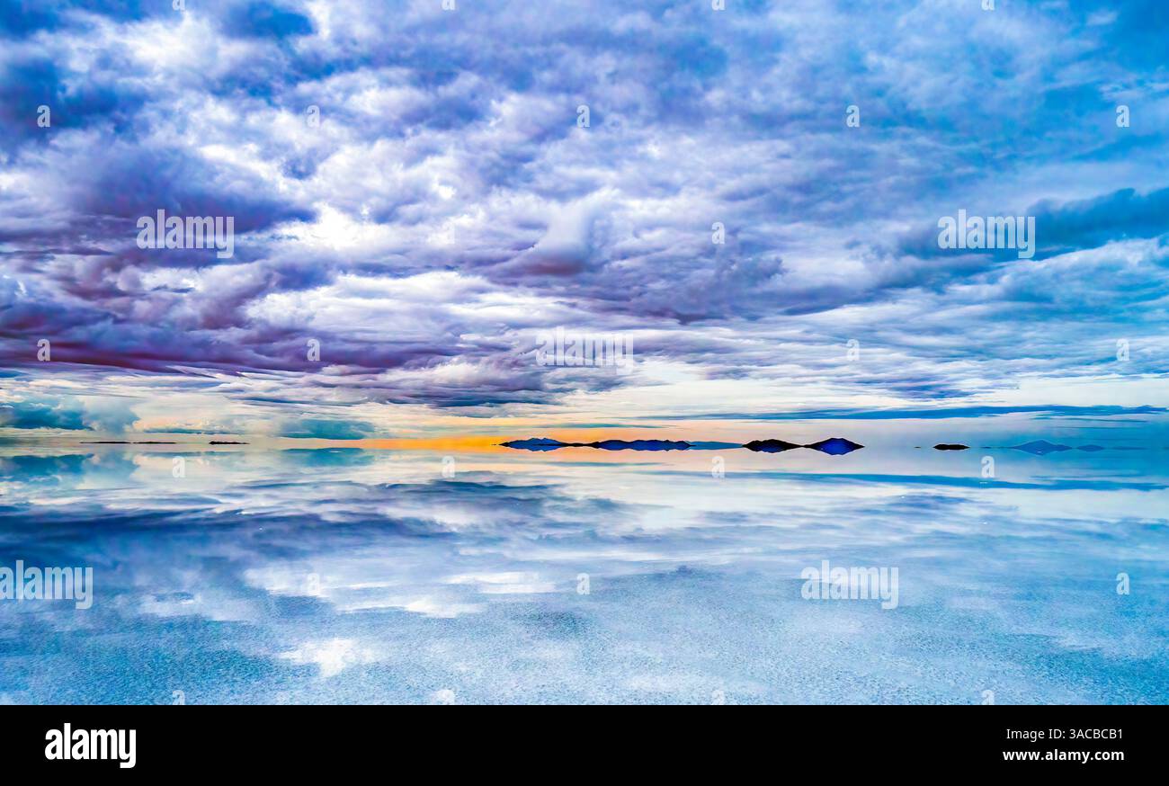 Salar de Uyuni, Bolivia. Wide angle landscape view at sunset of clouds ...