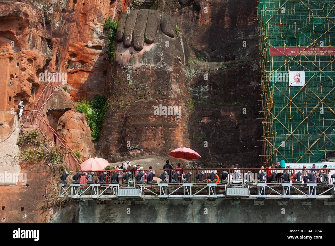 LESHAN, CHINA - APRIL 3, 2025 - Tourists visit the renovating Leshan ...