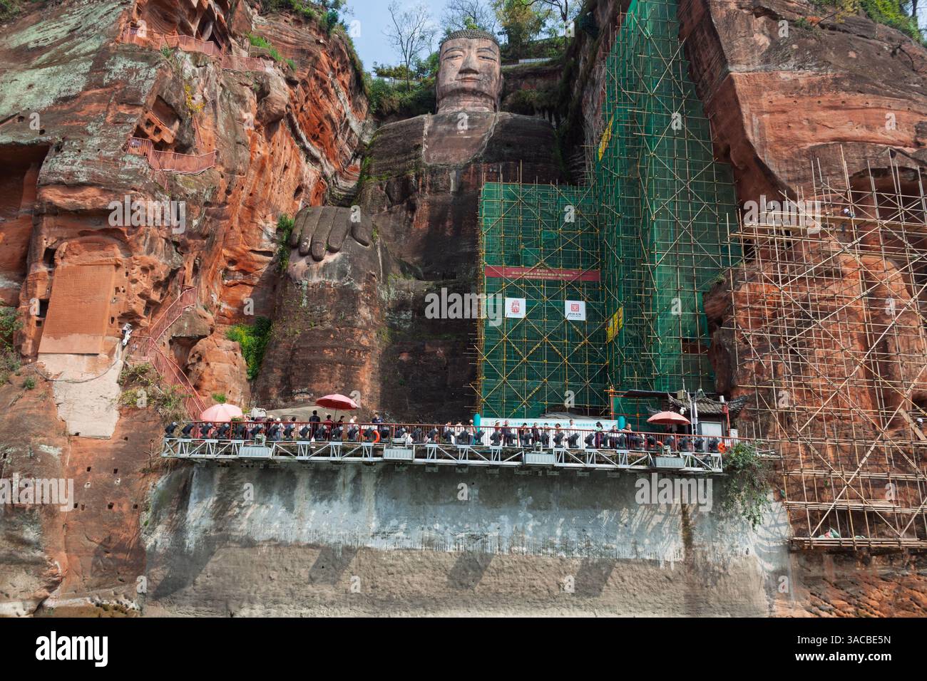 LESHAN, CHINA - APRIL 3, 2025 - Tourists visit the renovating Leshan ...