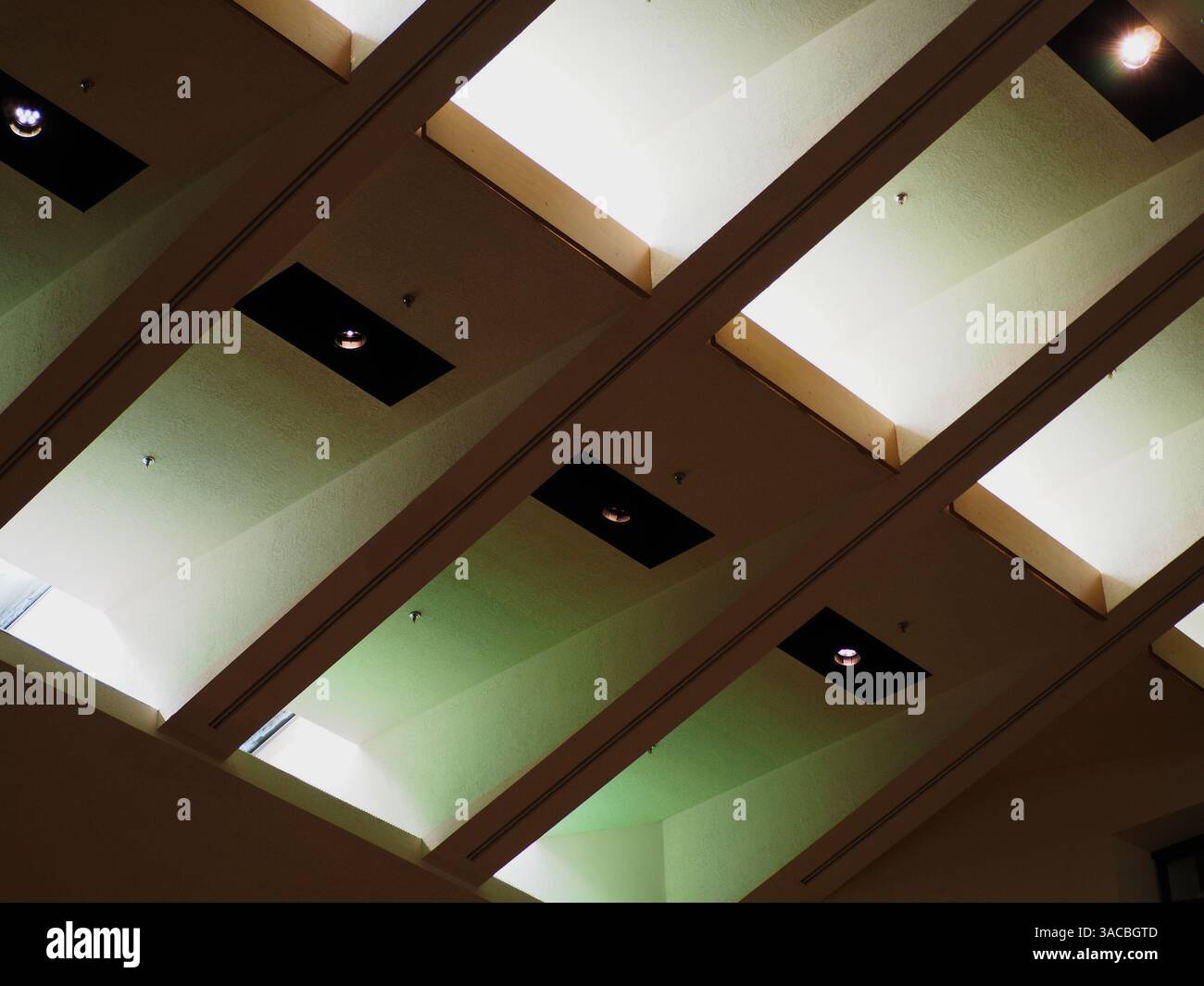 Modern Architectural Interior With Geometric Ceiling and Natural Light ...