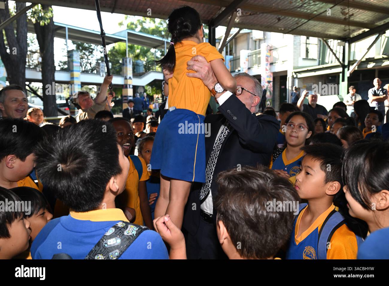 Australian Prime Minister Anthony Albanese lifts up a kid as he visits ...
