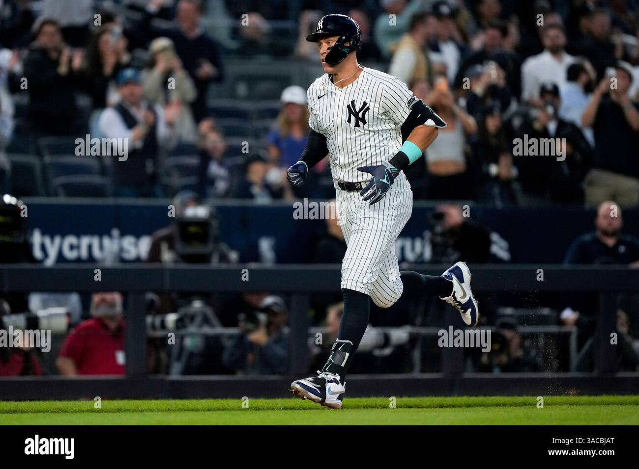 New York Yankees' Aaron Judge runs to home plate after homering on a ...