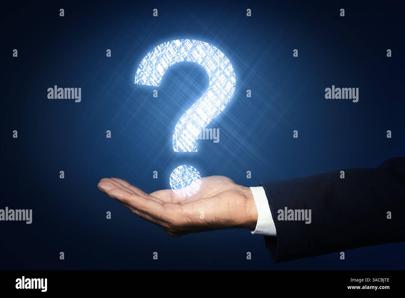 Businessman holding virtual question mark on dark background, closeup ...