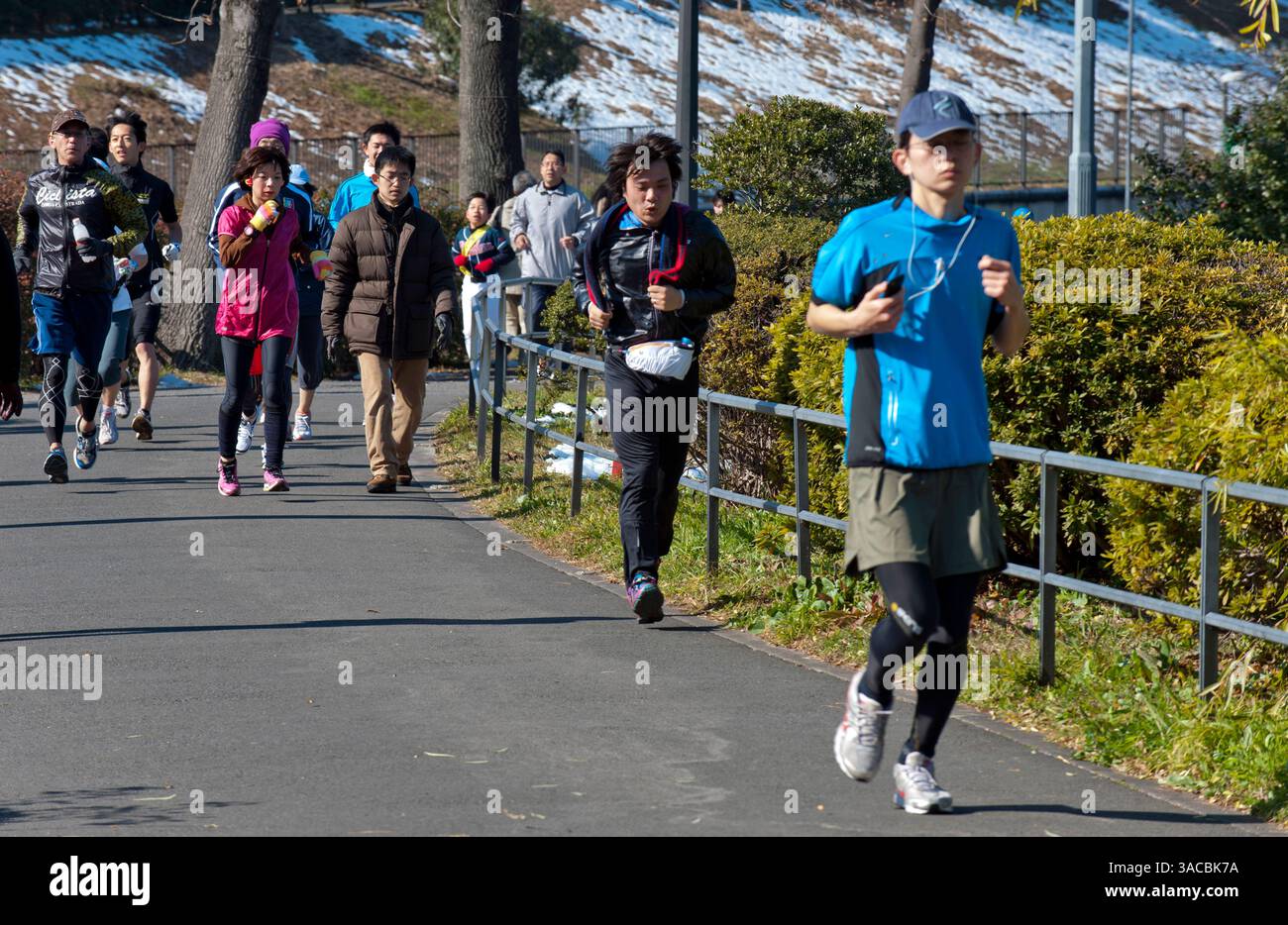 Male & female joggers taking laps around the 5-kilometer outer moat ...