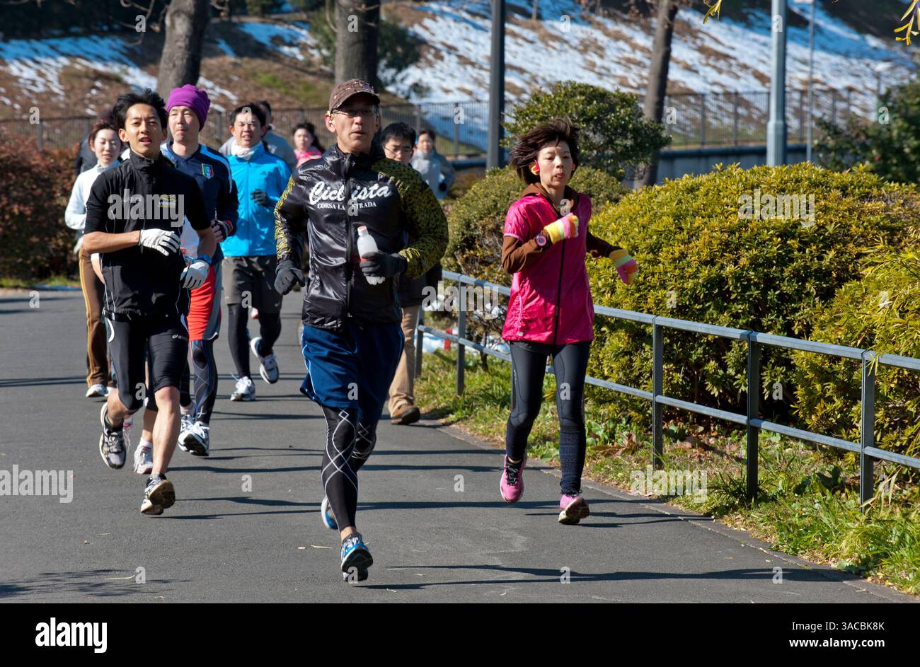 Male & female joggers taking laps around the 5-kilometer outer moat ...