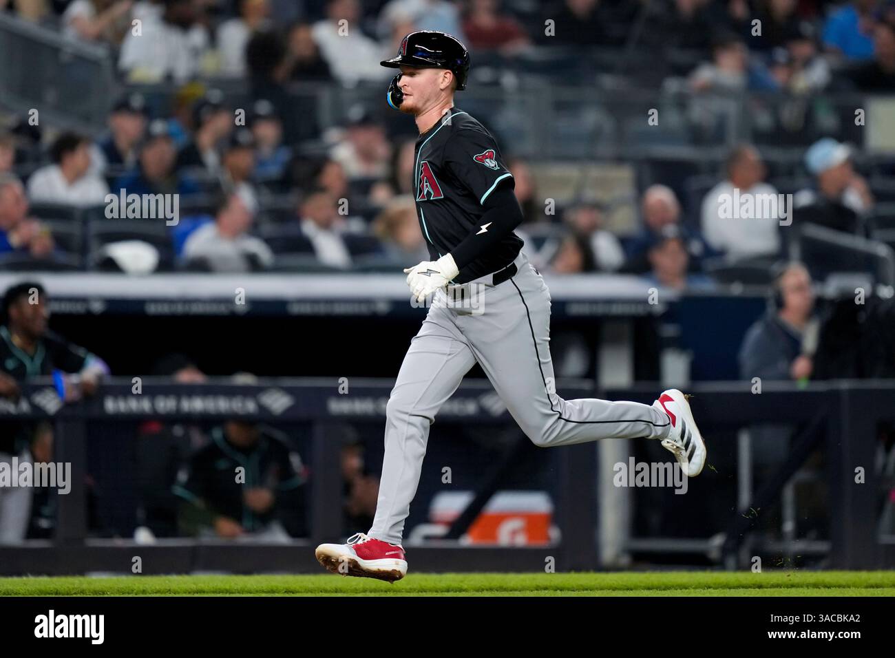 Arizona Diamondbacks' Pavin Smith scores during the fourth inning of a ...