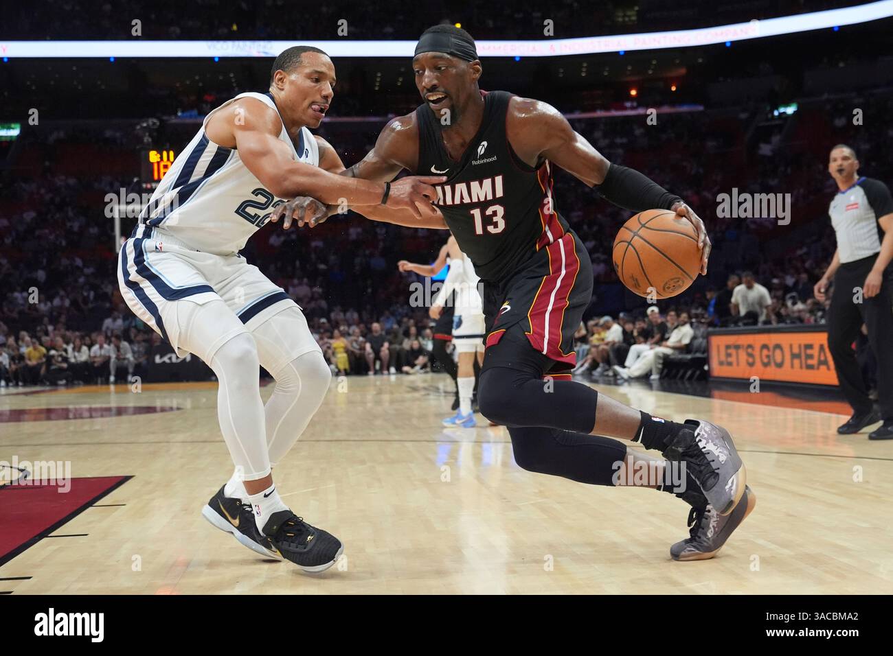 Miami Heat center Bam Adebayo (13) dribbles the ball as Memphis ...