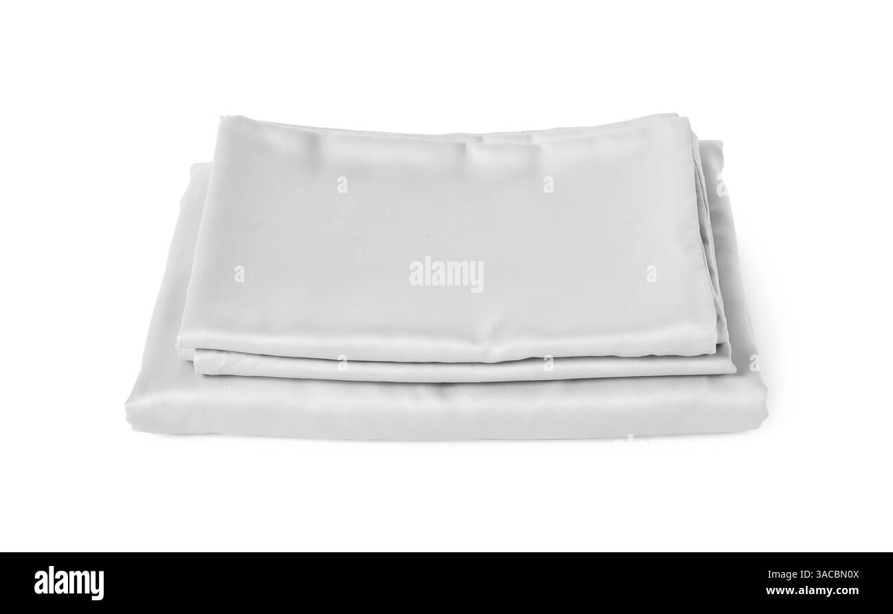 Stack of silky bed linens on white background Stock Photo - Alamy