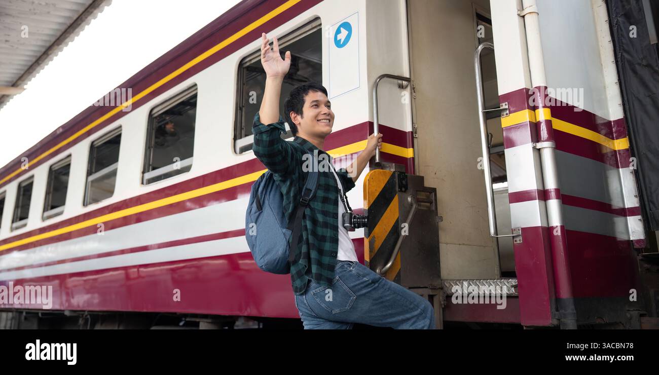 Boarding the Train for an Adventure. An excited traveler boards the ...